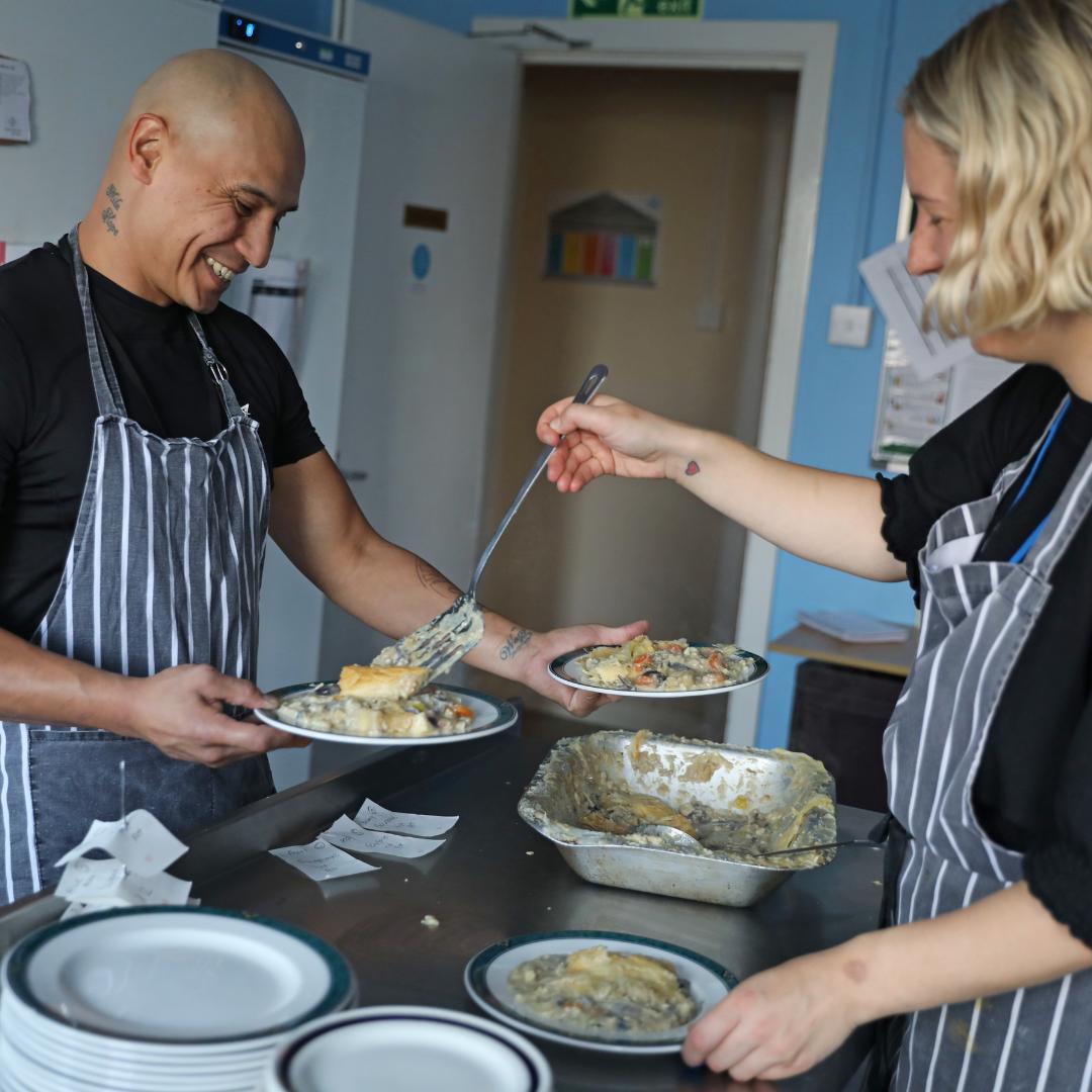 This is an image of people serving food in one of the SVP CSPs